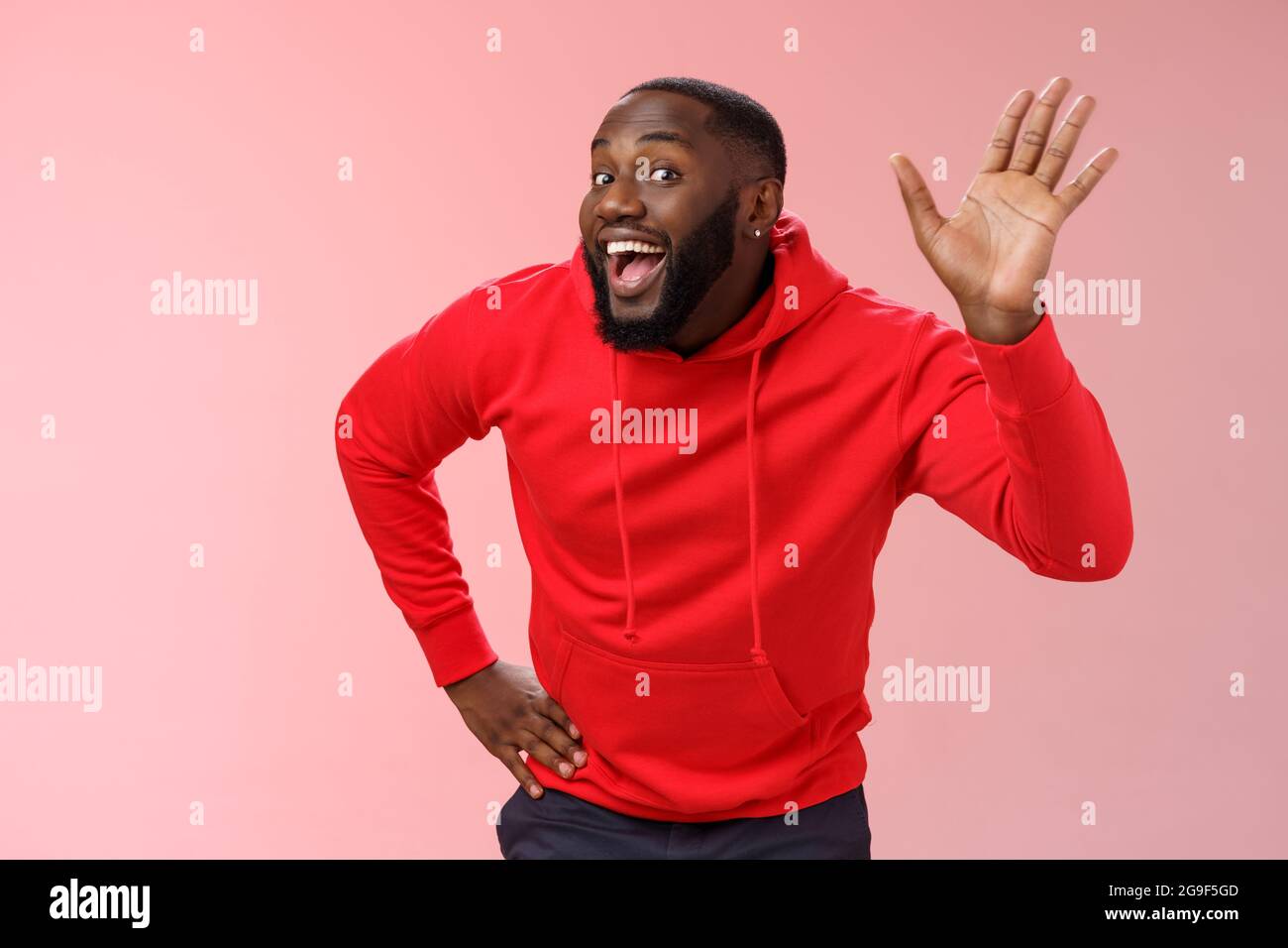 Attractive funny african american gay beard in red hoodie raise palm ...
