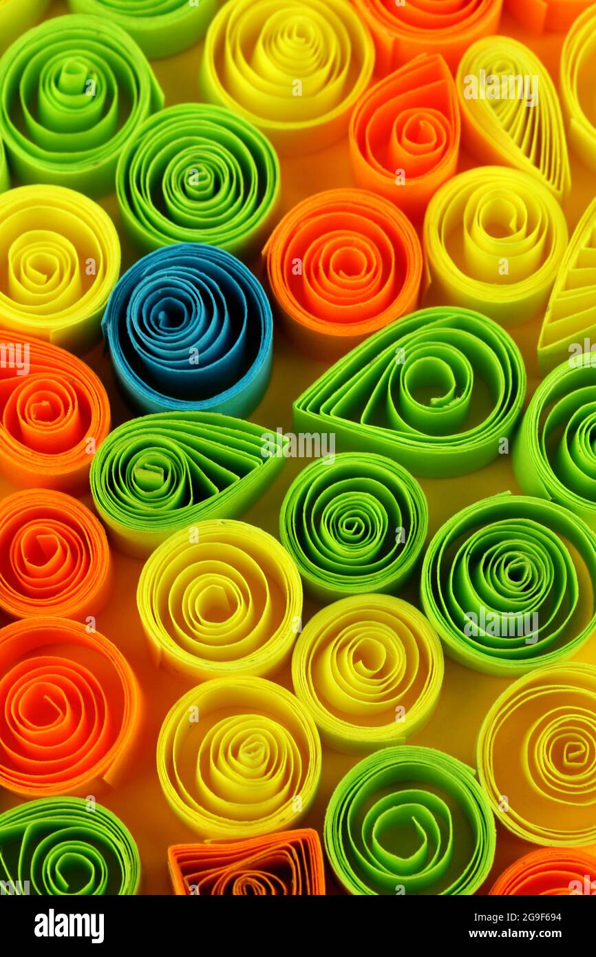 Colorful quilling on yellow background close-up Stock Photo - Alamy