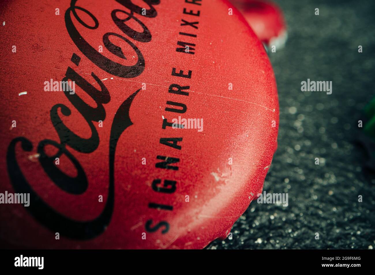 KRASNODAR, RUSSIA - NOVEMBER 9, 2020: Macro photo of Coca Cola lids on ...