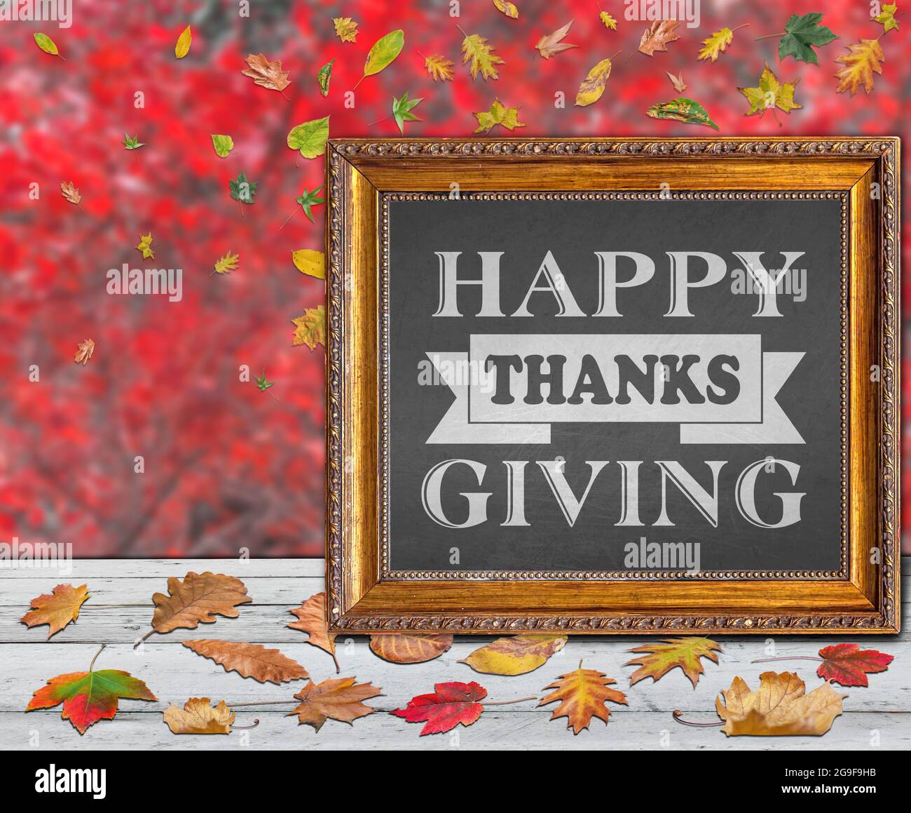 Happy Thanks Giving inside frame with red and colored autumn leaves in ...