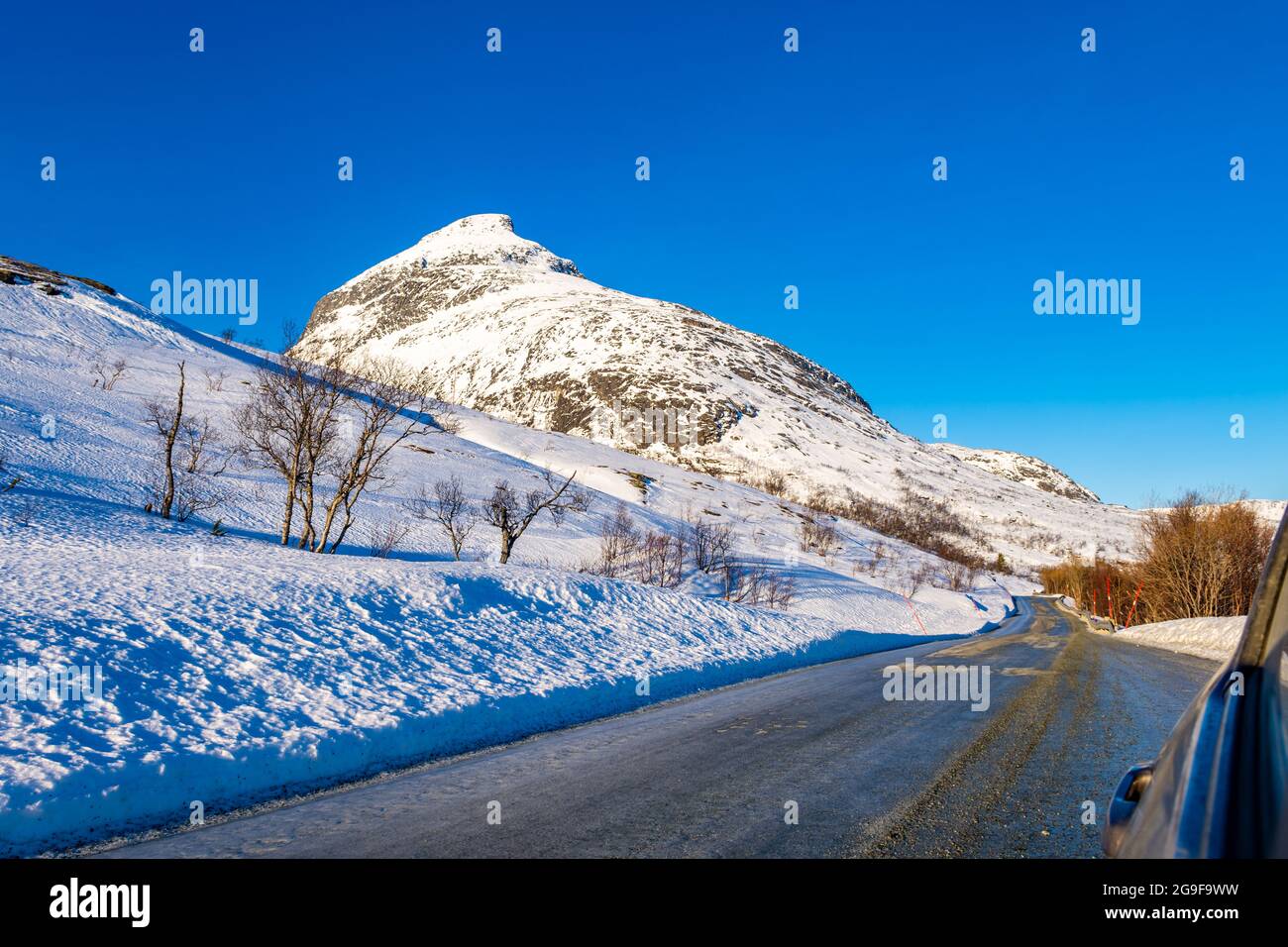 Beautiful view of the frozen mountains covered in snow on a cold winter ...