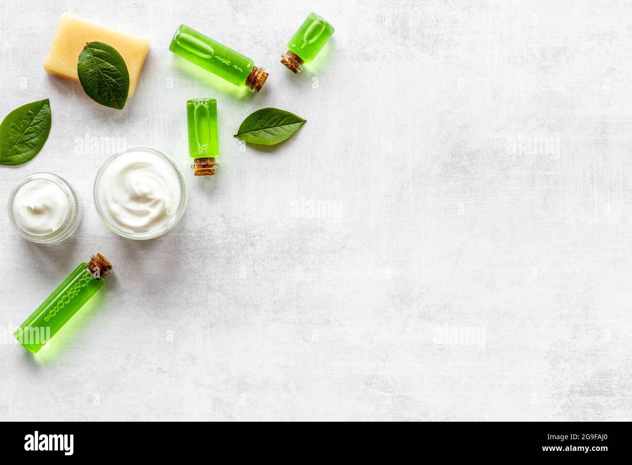 Green tea aroma oil and cosmetic with tea tree leaf Stock Photo - Alamy