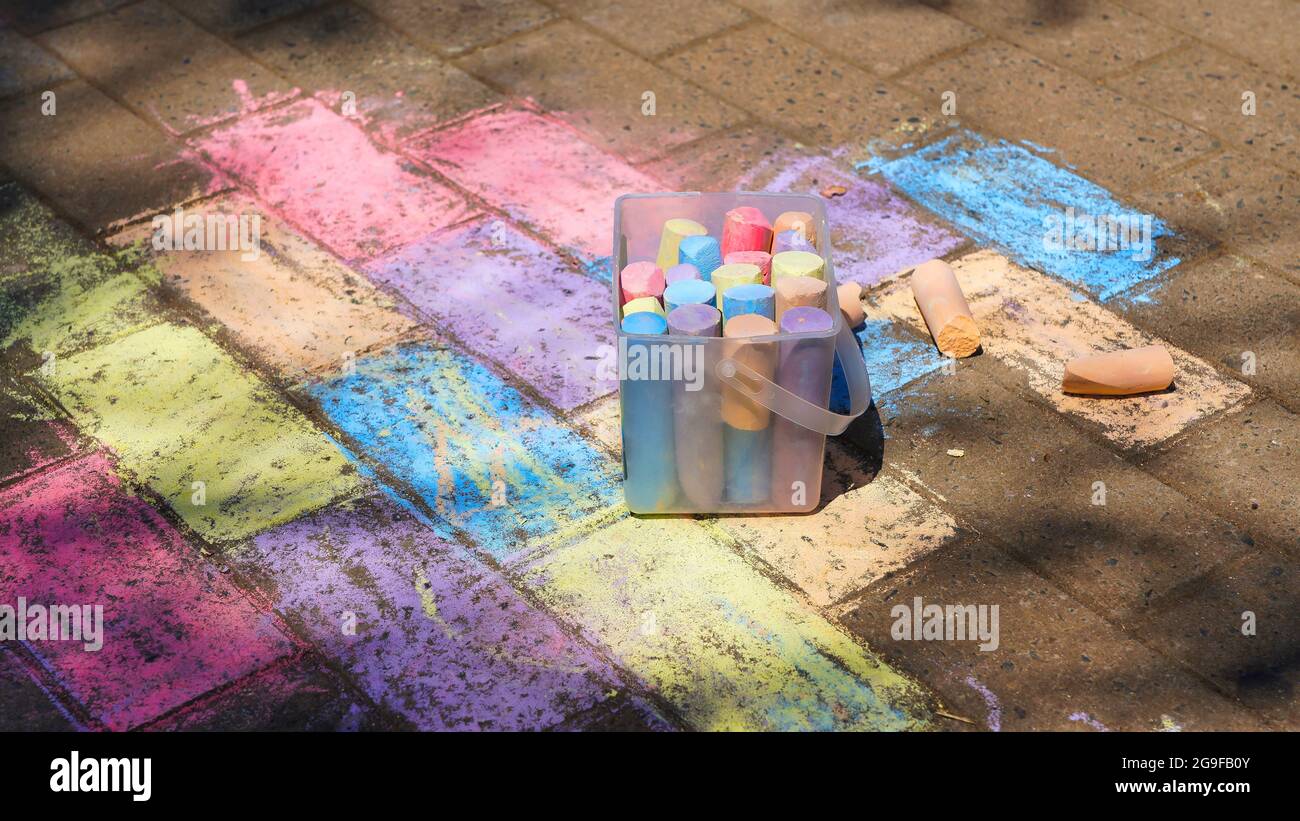 box of crayons on the sidewalk Stock Photo - Alamy