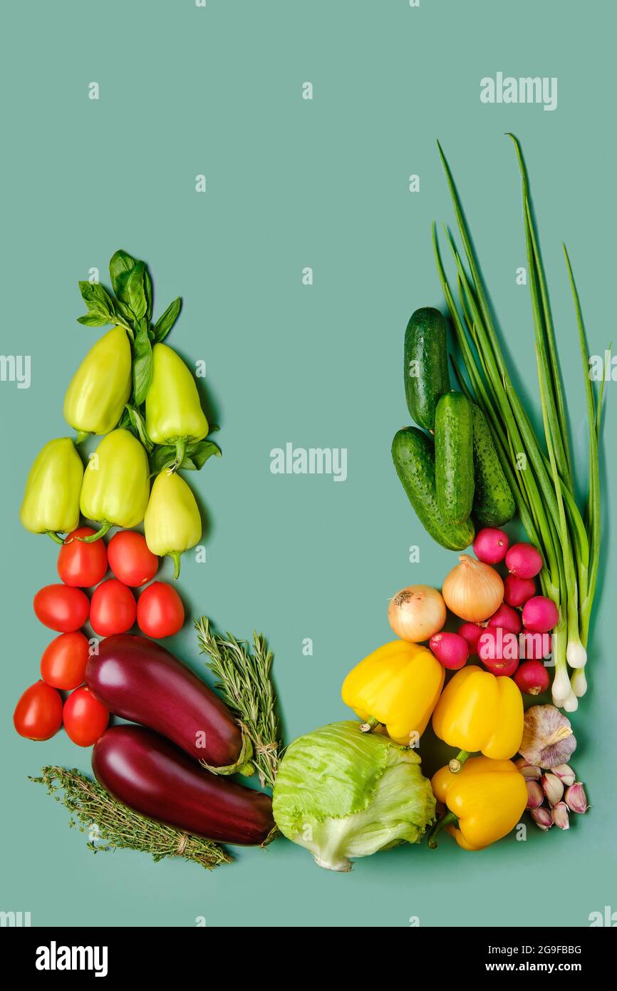 Composition with fresh vegetables on pale green background Stock Photo ...