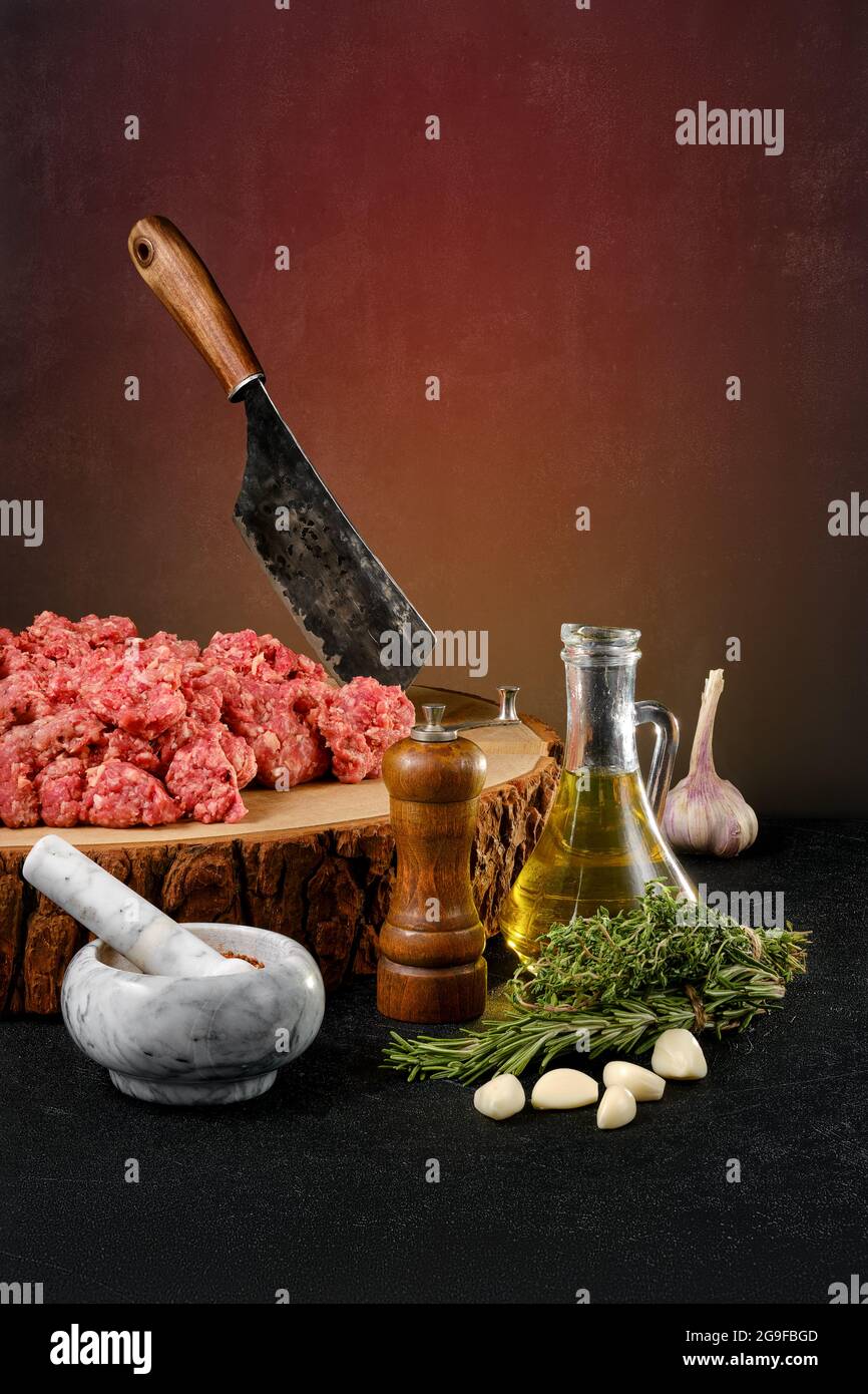 Chopped with butcher cleaver lamb ground meat on wooden stump Stock ...