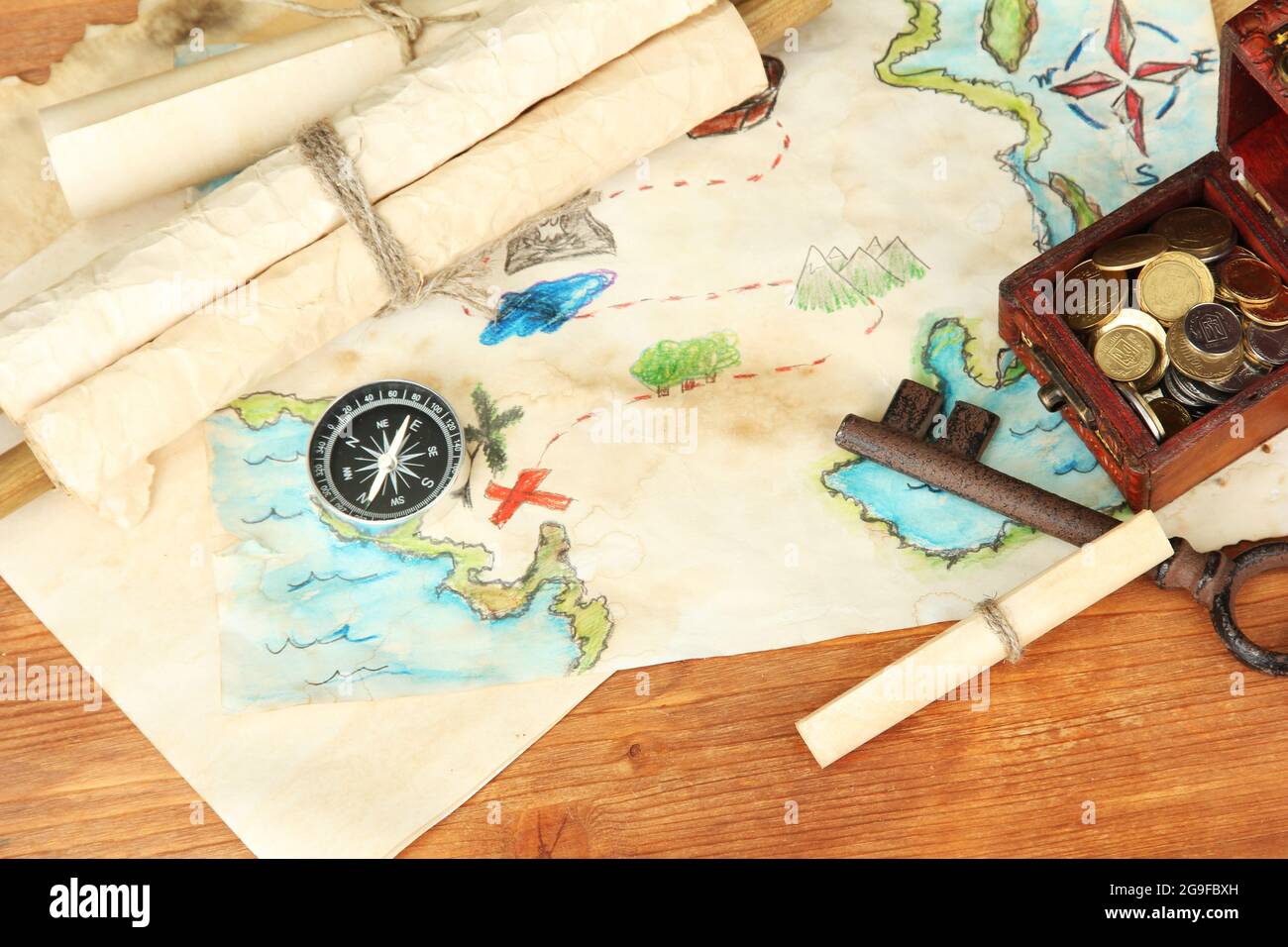 map of treasures on wooden background Stock Photo - Alamy