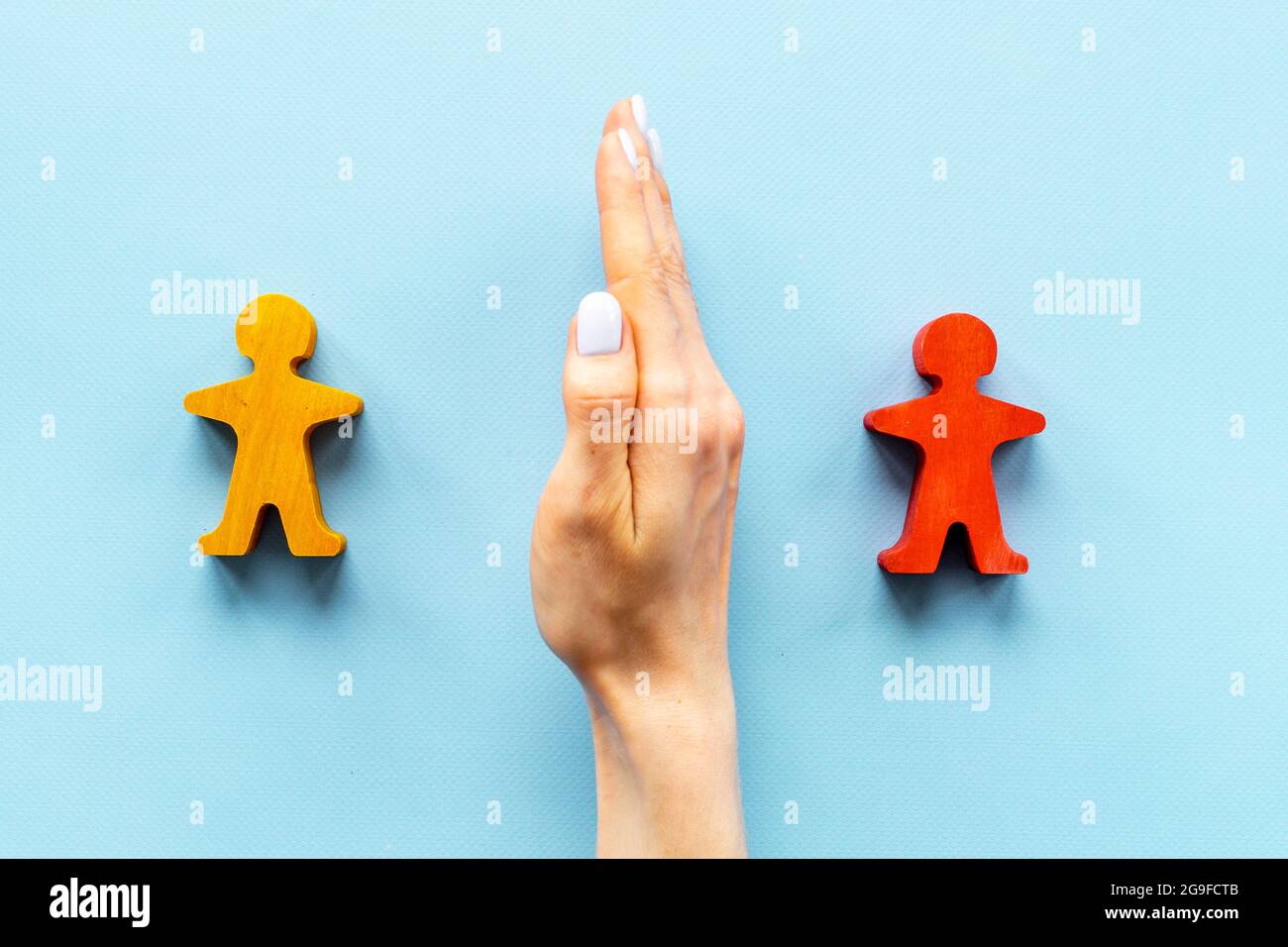 Wooden human figures - mediator arbitrator conflict resolving Stock ...