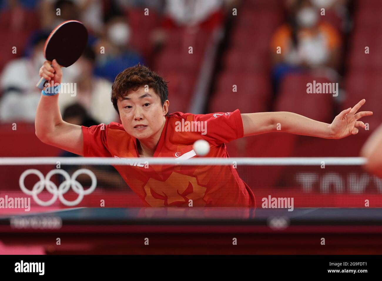 Tokyo, Japan. 26th July, 2021. Feng Tianwei of Singapore hits a return ...
