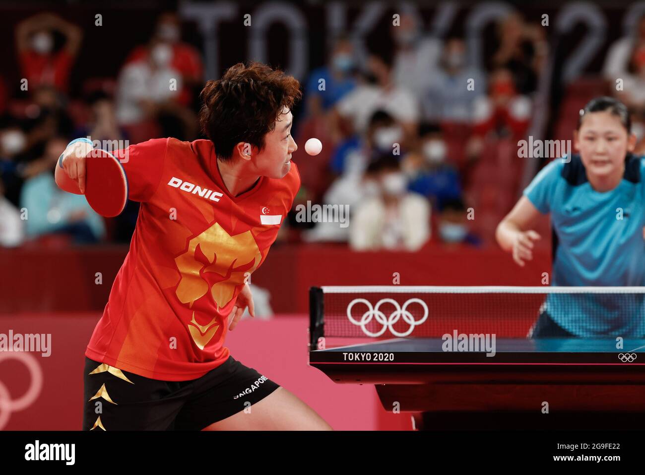 Tokyo, Japan. 26th July, 2021. Feng Tianwei (L) of Singapore serves ...