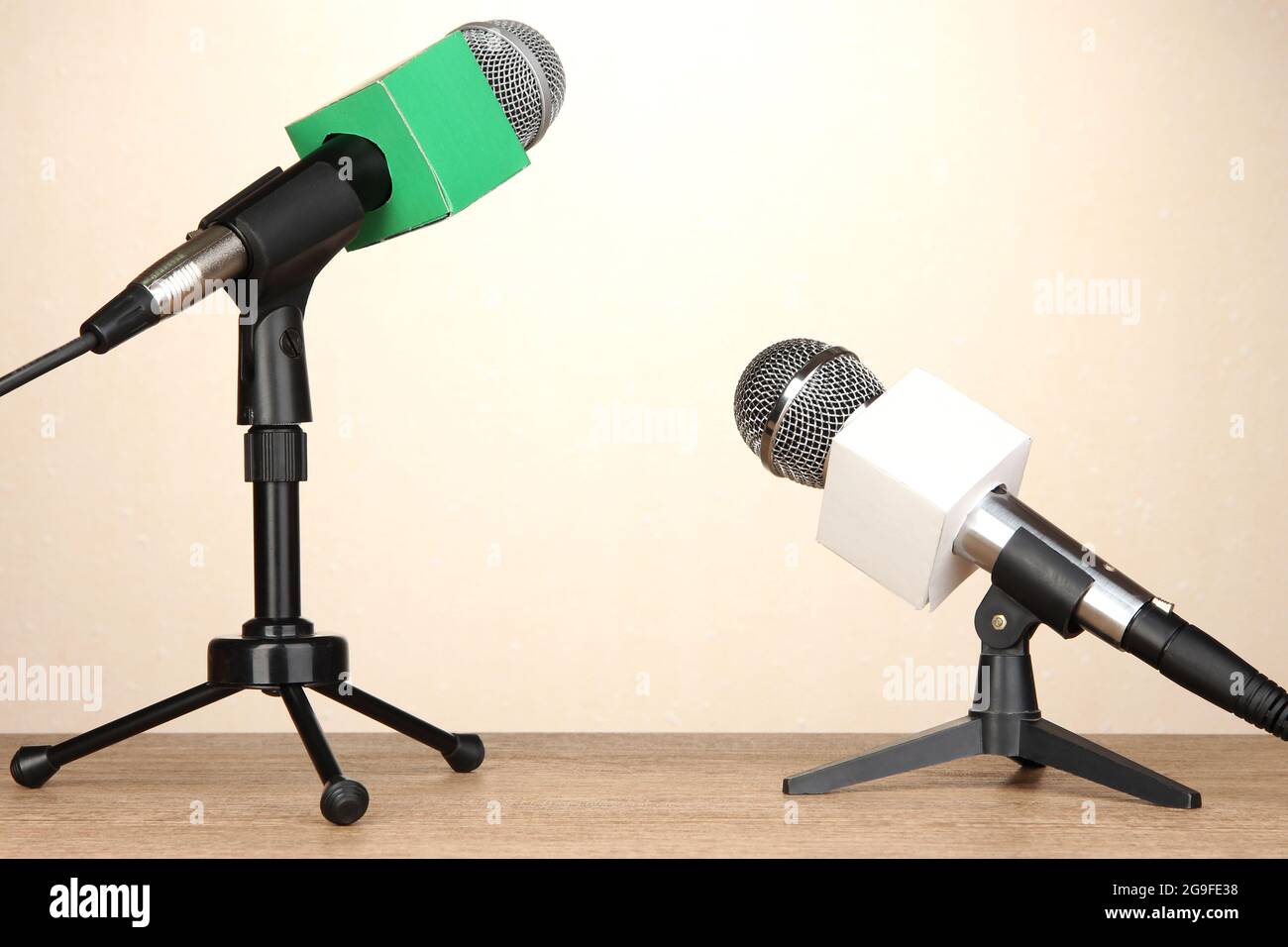 Microphone stands on meeting room table Stock Photo - Alamy