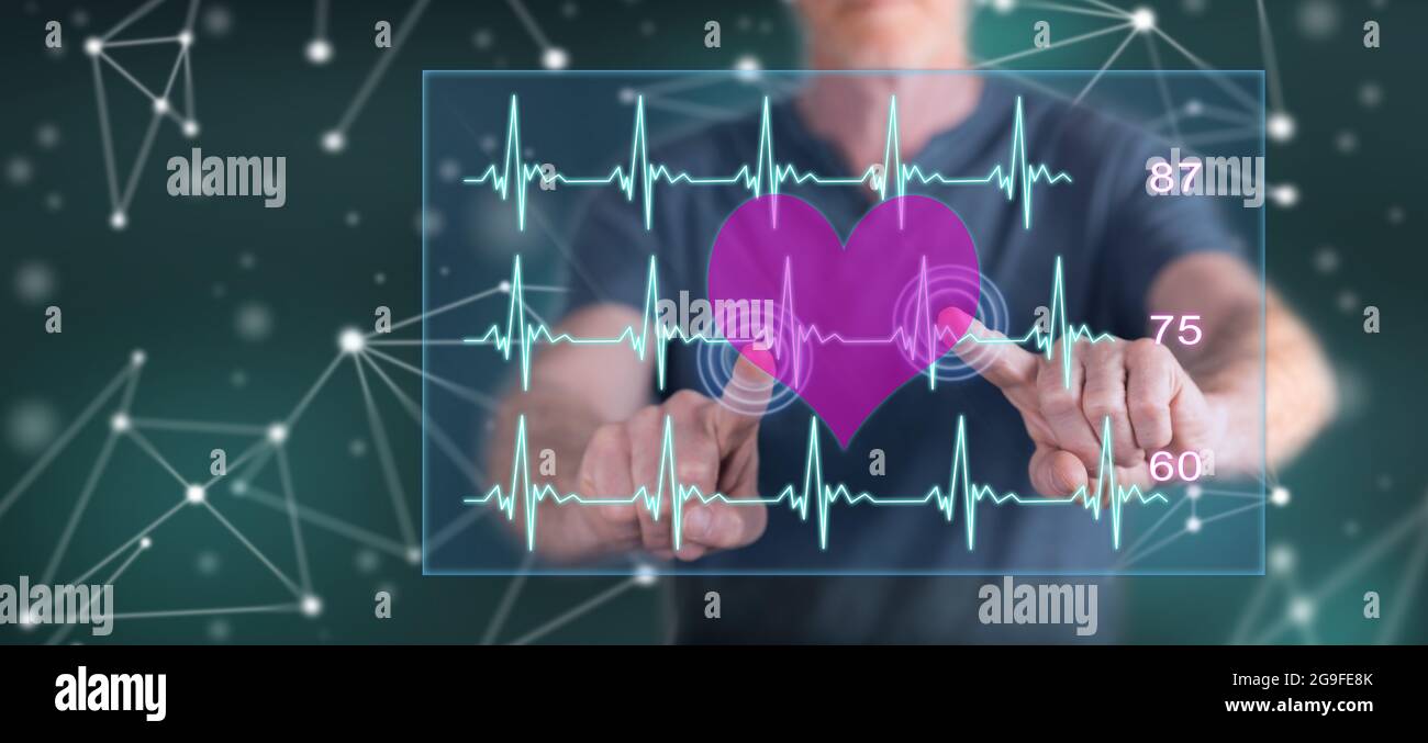 Man touching a heart beats graph concept on a touch screen with his ...