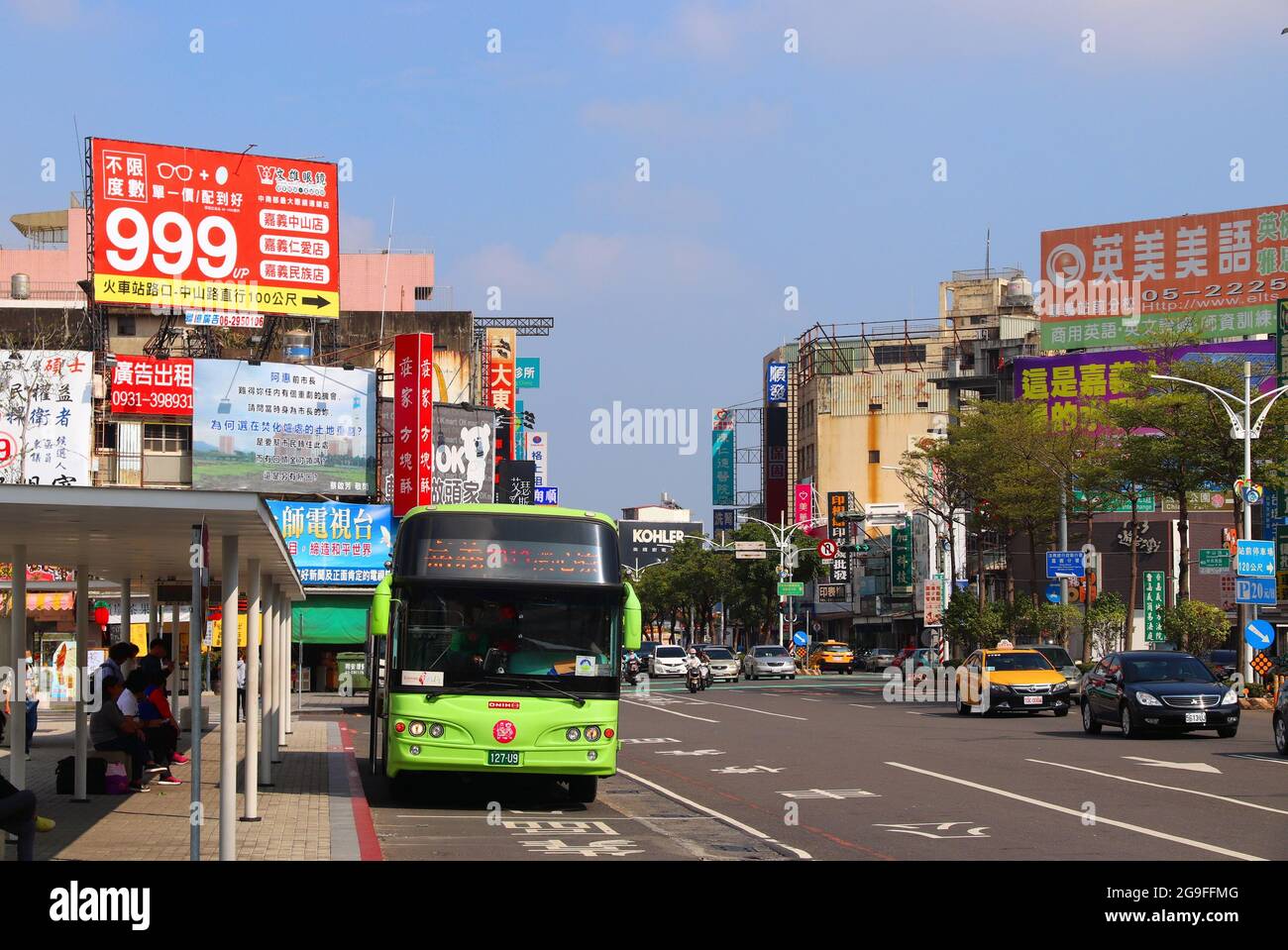 CHIAYI, TAIWAN - NOVEMBER 30, 2018: People wait at the bus station in ...