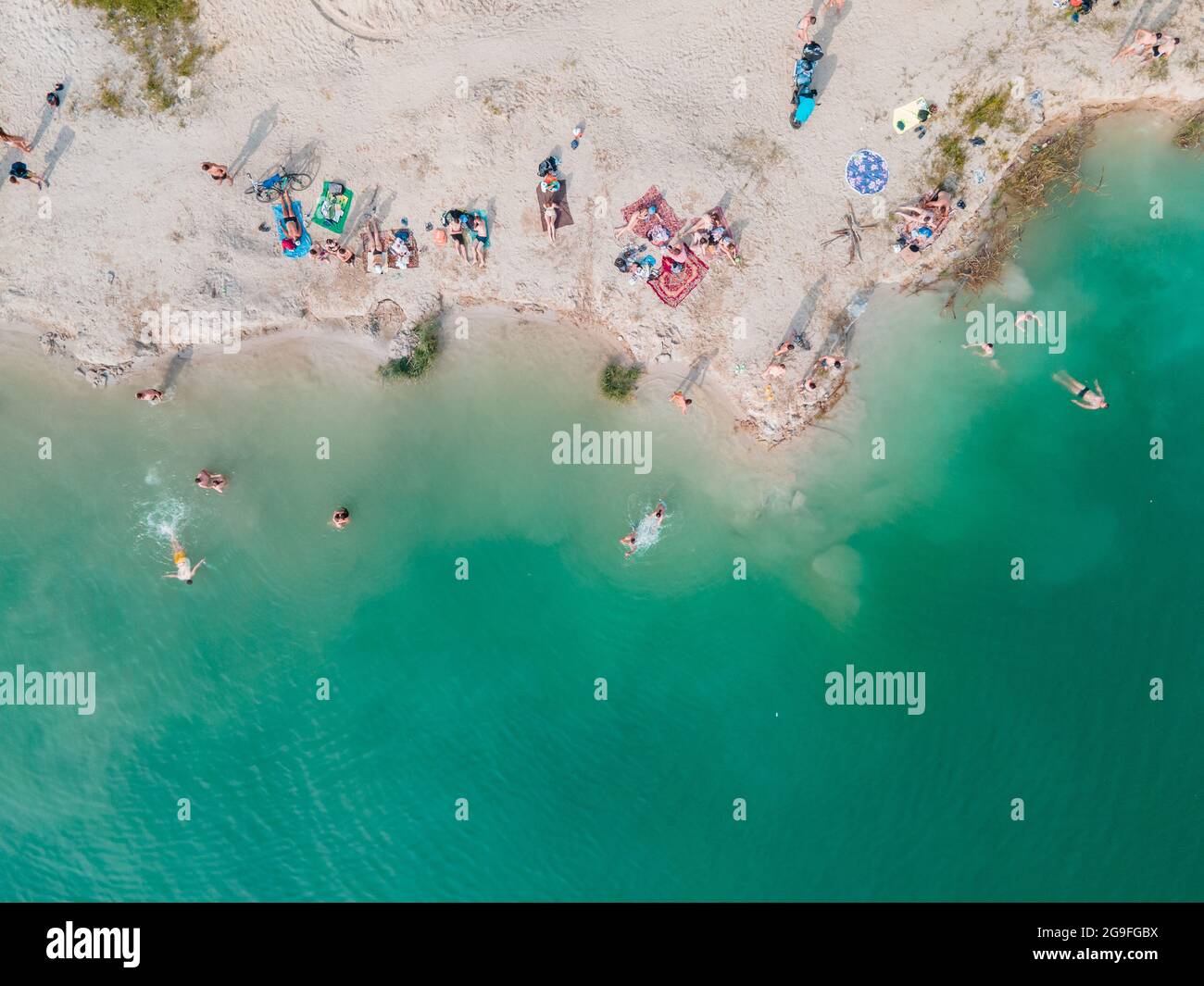 aerial view of people swimming in blue azure water sunbathing resting ...