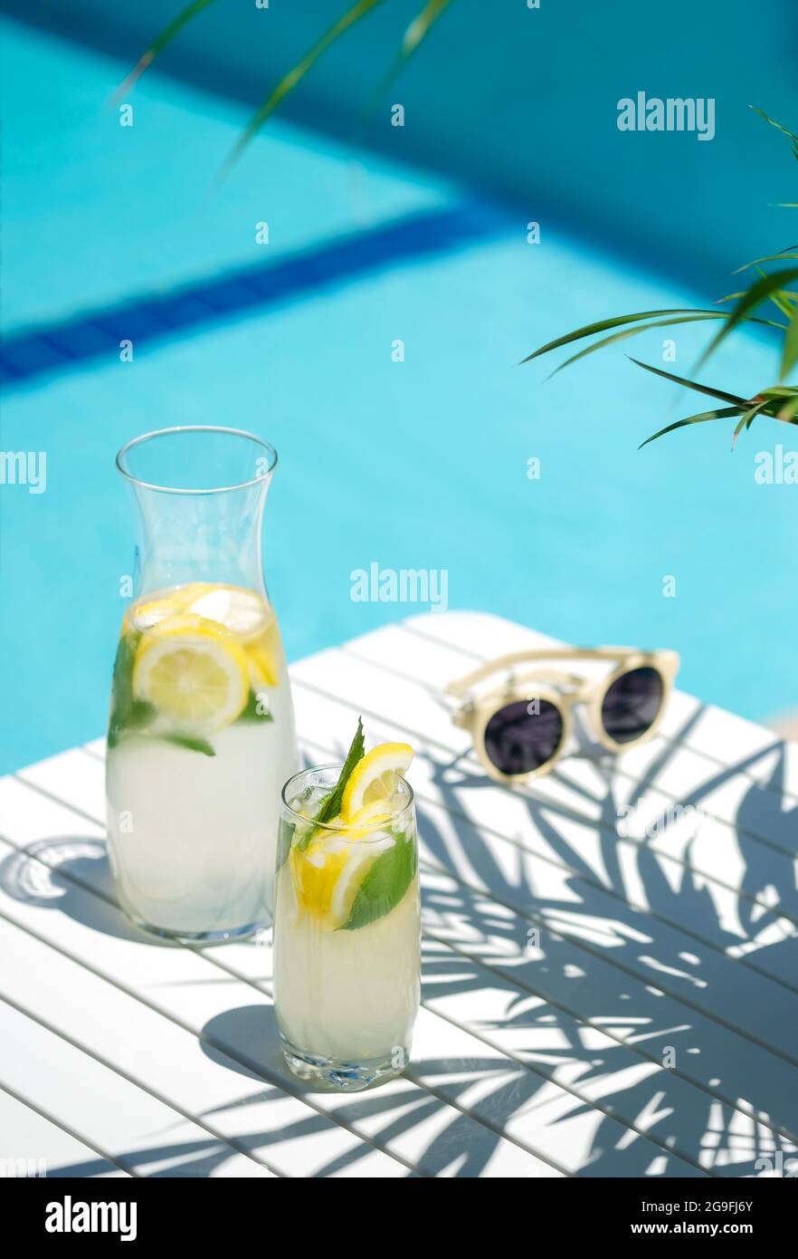 Homemade lemonade in glasses with lemon slice, on white table,in the ...