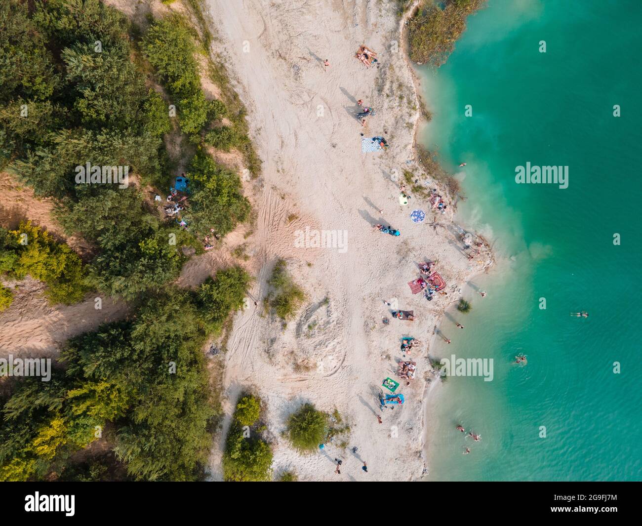 aerial view of people swimming in blue azure water sunbathing resting ...