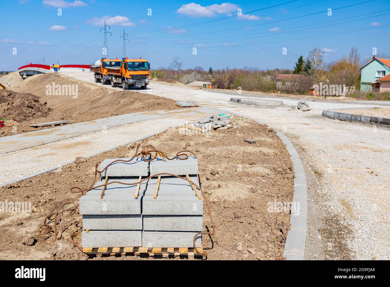 Stack of packed border stones for asphalt road on wooden pallet at ...