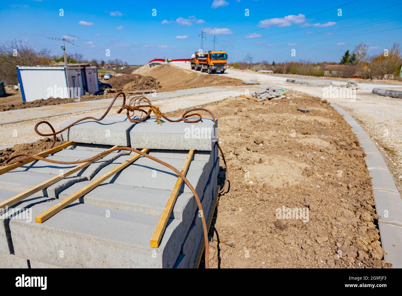 Stack of packed border stones for asphalt road on wooden pallet at ...