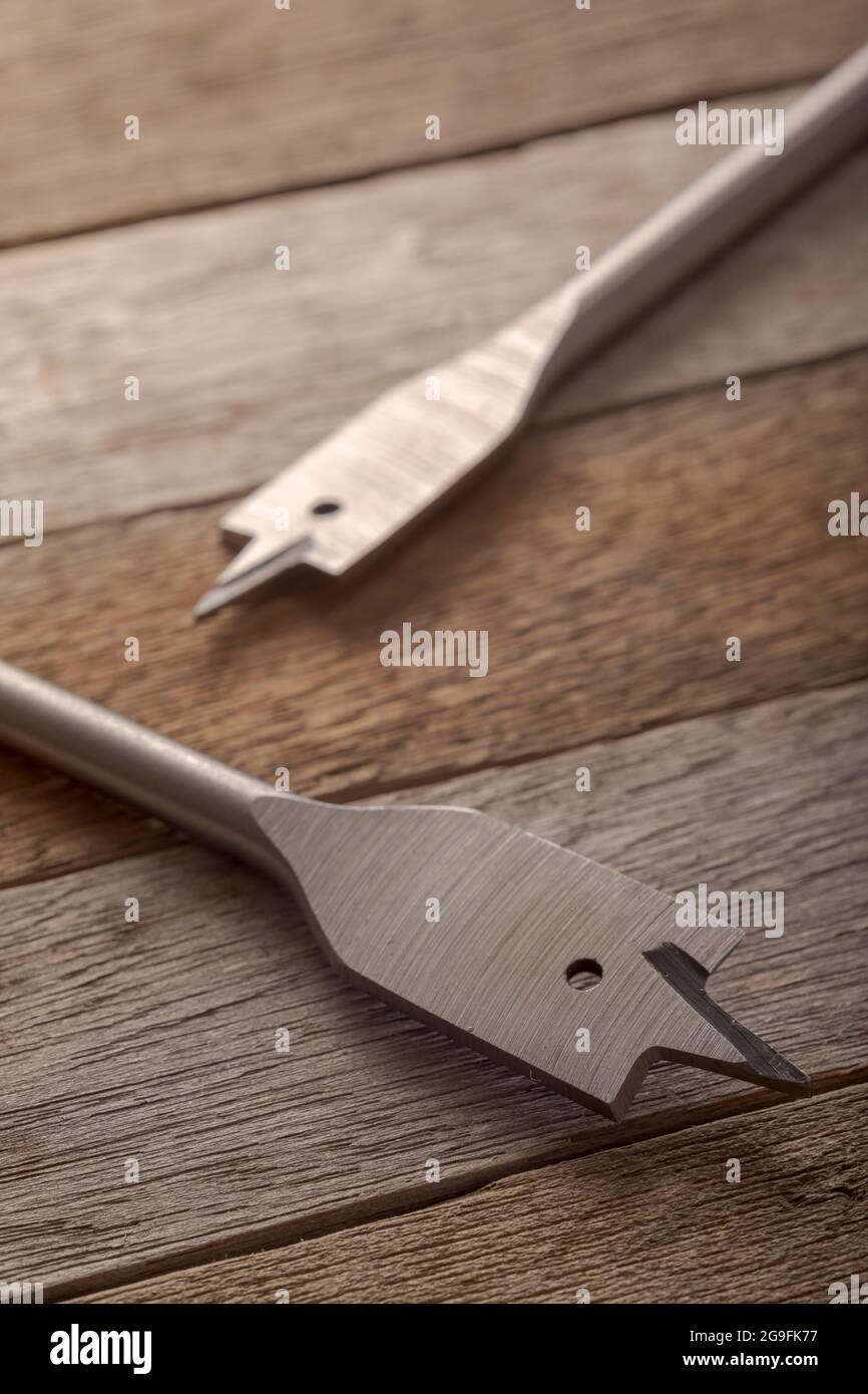Feather wood drill bit on wooden background. Drill bit for wood on ...