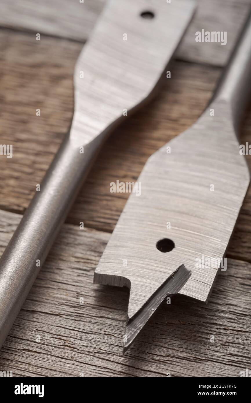 Feather wood drill bit on wooden background. Drill bit for wood on ...