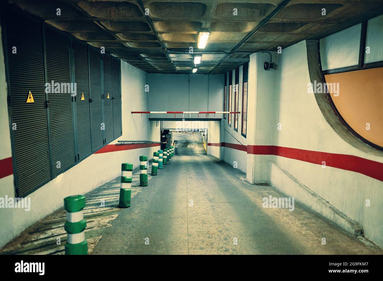 Entrance gate in underground parking. Empty garage Stock Photo - Alamy
