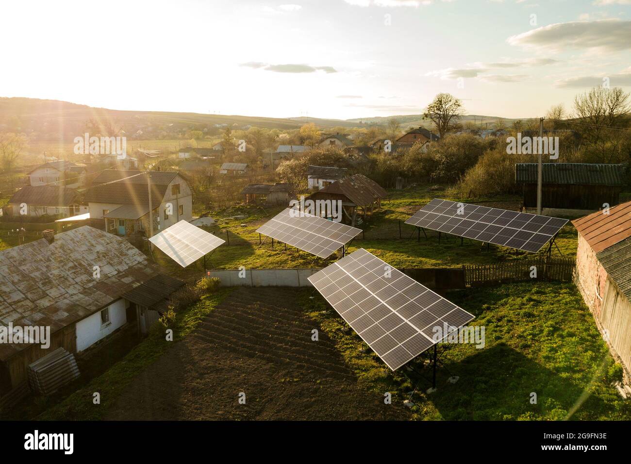 Aerial top down view of solar panels in green rural village yard Stock ...