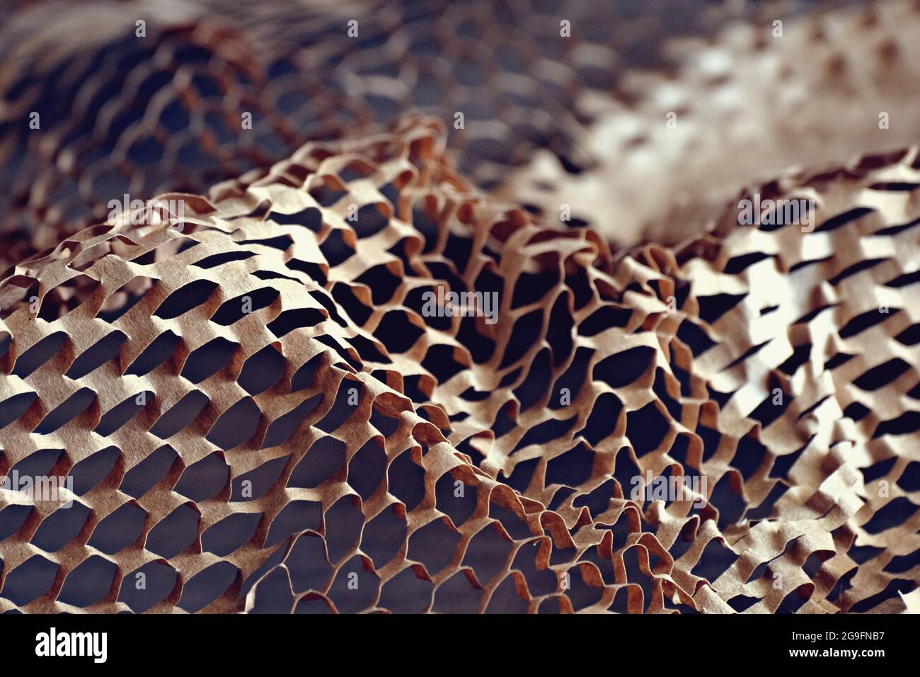 Abstract background with perforated wrapping paper Stock Photo - Alamy