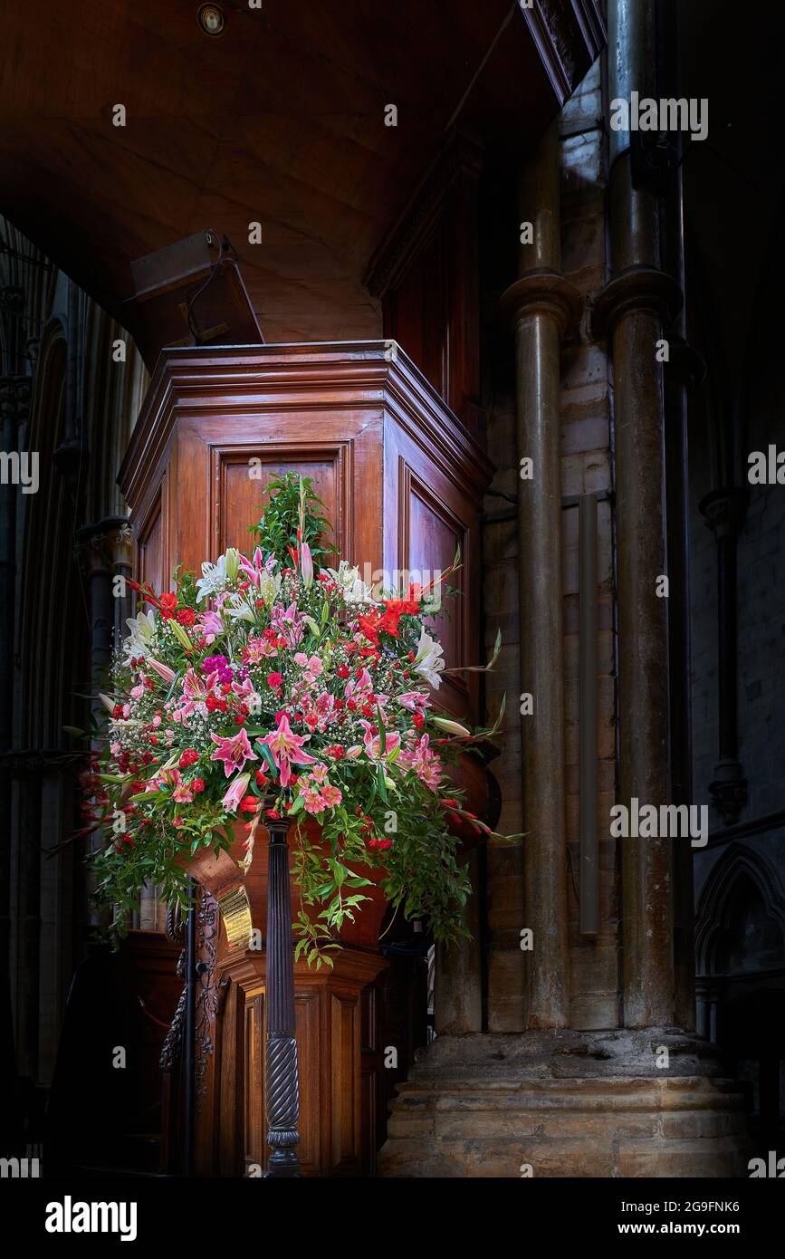 Flower display in front of the pulpit at the christian medieval ...