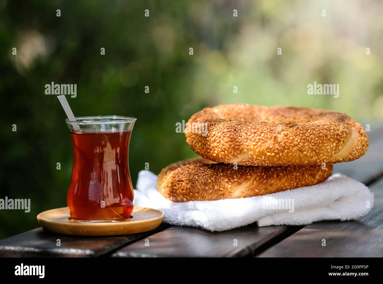Traditional Turkish sesame bagel simit and Turkish tea on wood ...