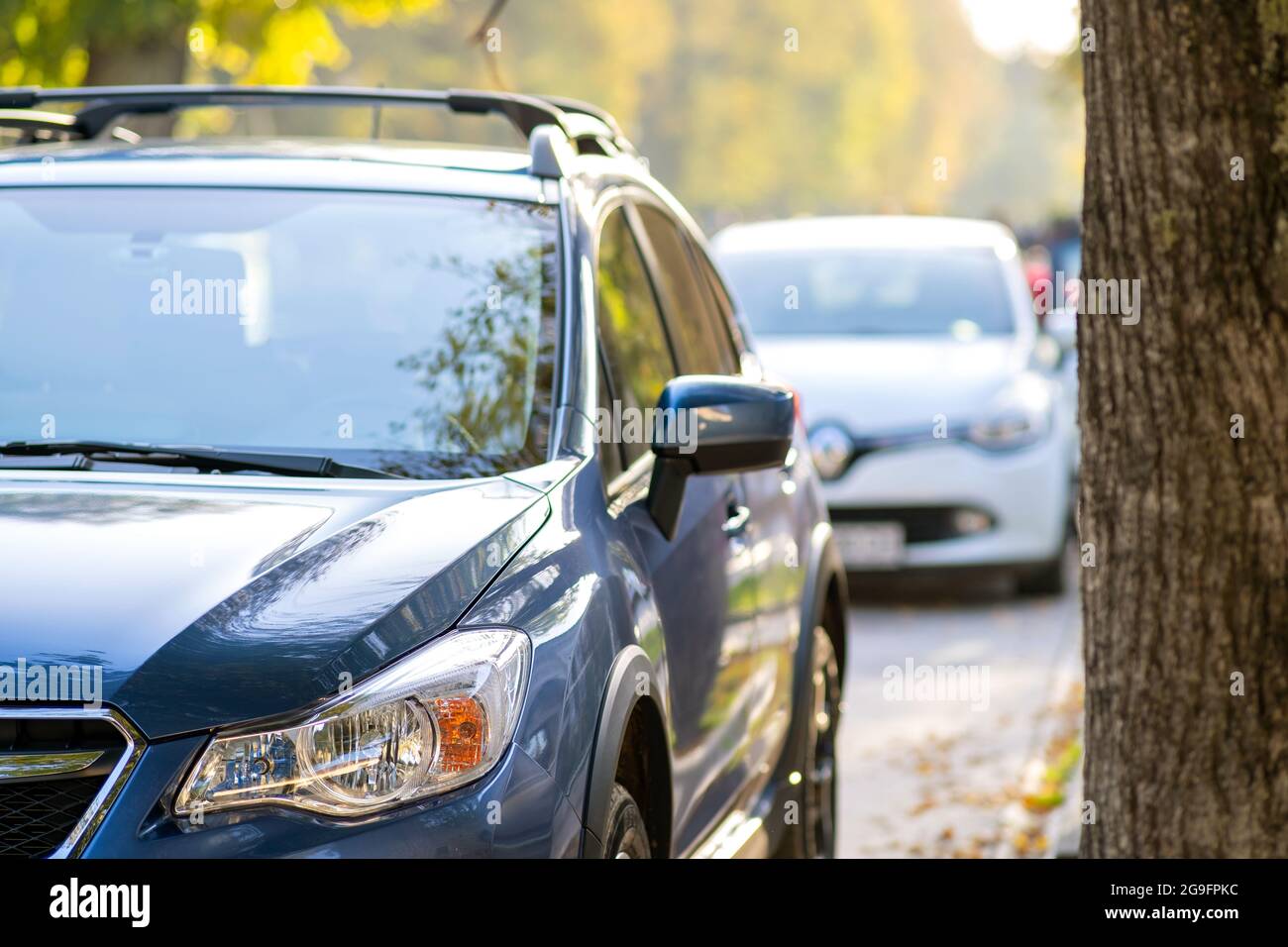 New clean car parked on a city street side Stock Photo - Alamy