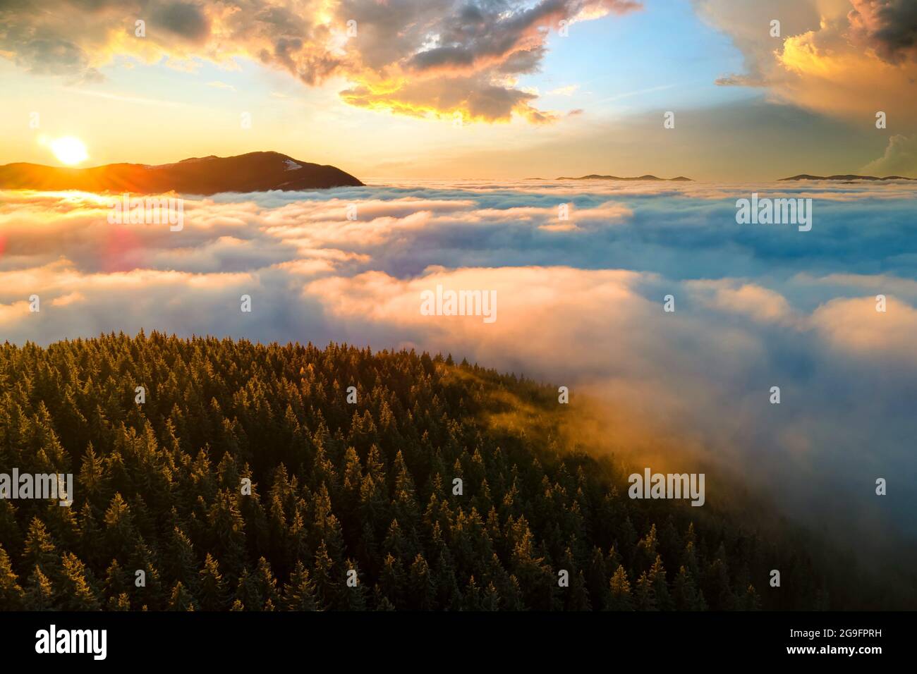 Sunlight over hills dense woodland hi-res stock photography and images ...