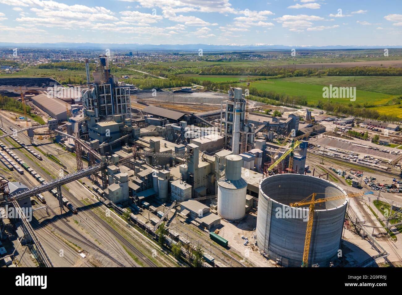 Aerial view of cement plant with high concrete factory structure and ...