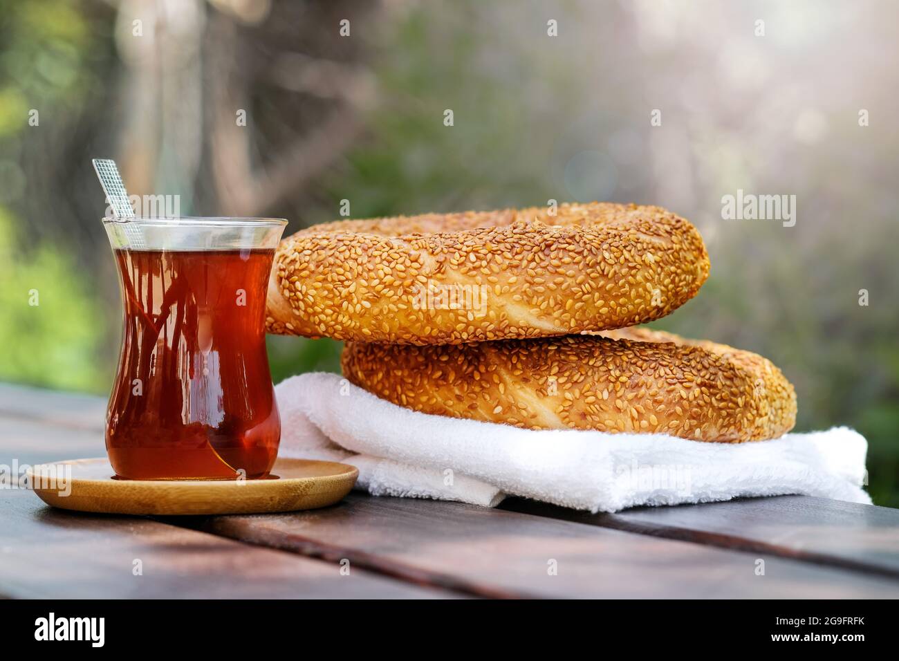 Traditional Turkish sesame bagel simit and Turkish tea on wood ...