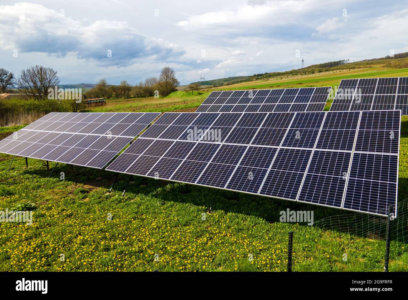 Aerial view of blue photovoltaic solar panels mounted on backyard ...