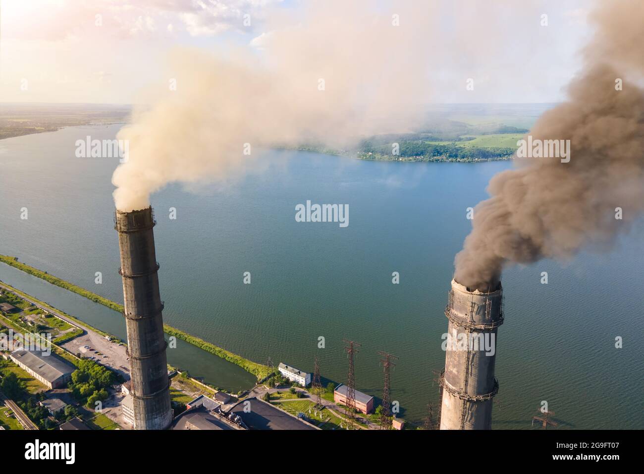 Aerial view of coal power plant high pipes with black smokestack ...