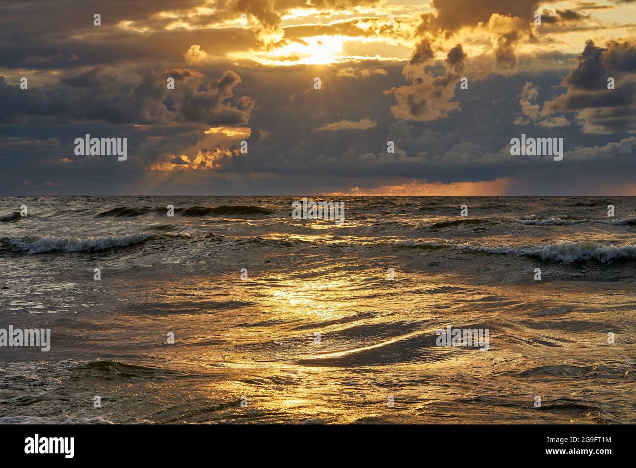 Epic dark sunset sky above the sea shore after the storm Stock Photo ...