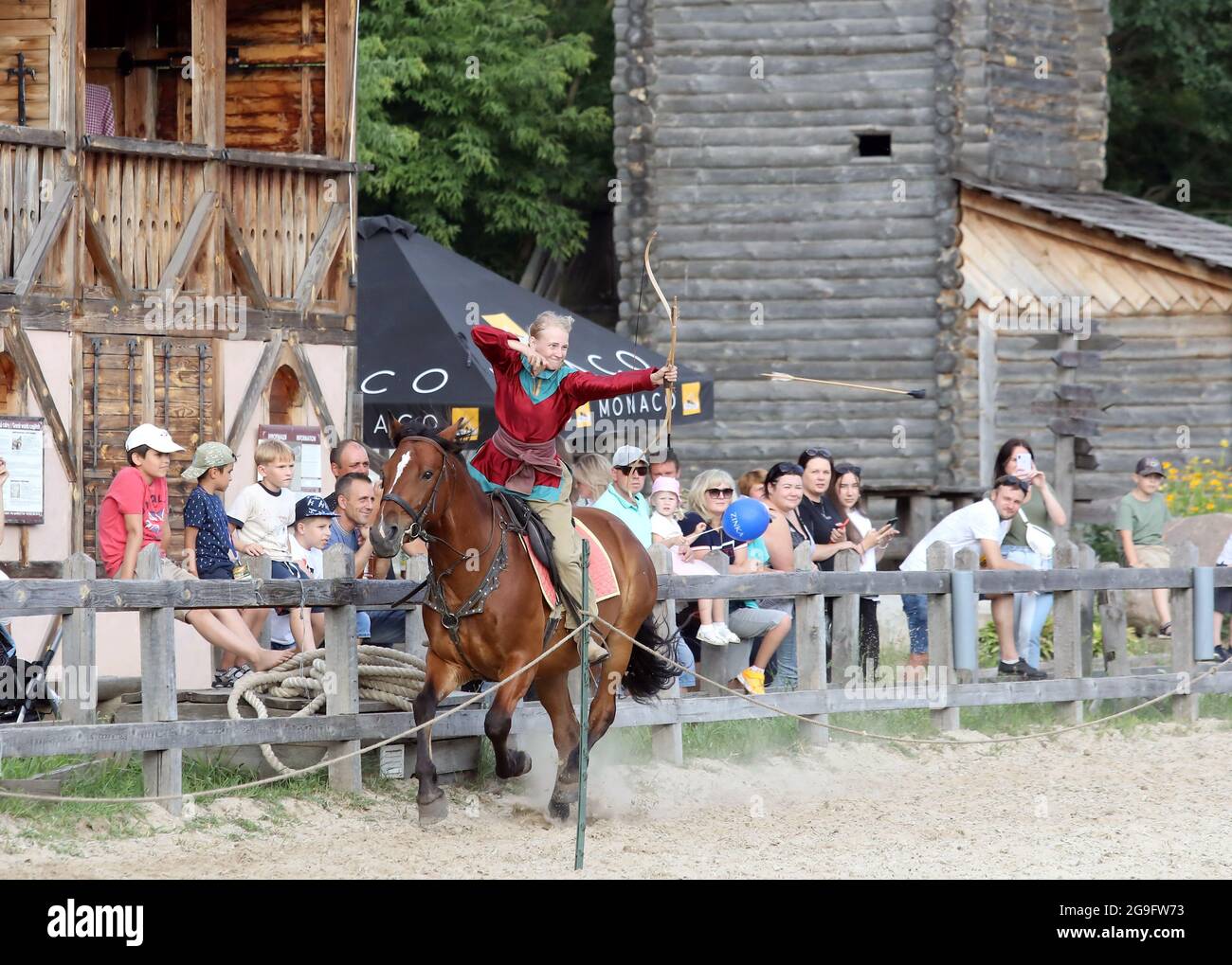 KOPACHIV, UKRAINE - JULY 24, 2021 - An archer riding a horse shows ...