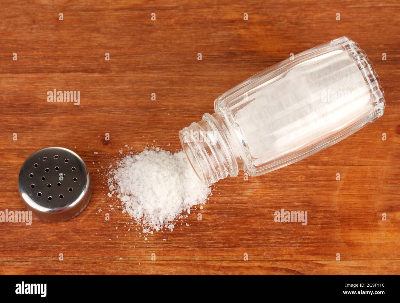 Salt sprinkled on table Stock Photo - Alamy
