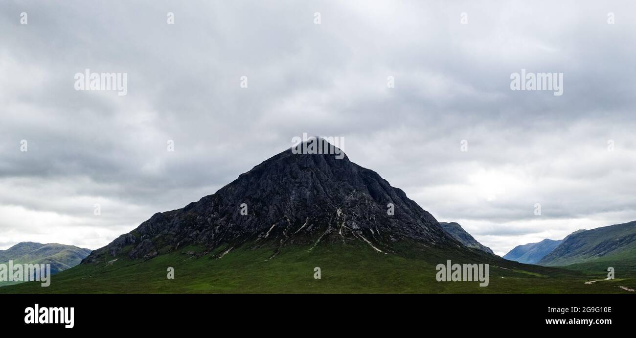 Eerie scenery of a majestic mountain in Glencoe village in Scotland on ...