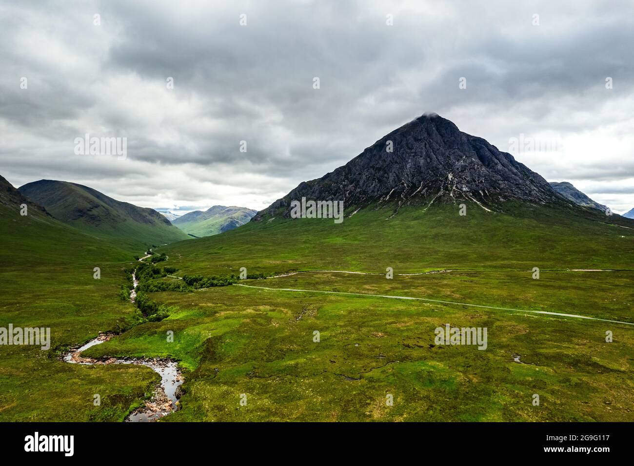 Eerie scenery of a majestic mountain in Glencoe village in Scotland on ...