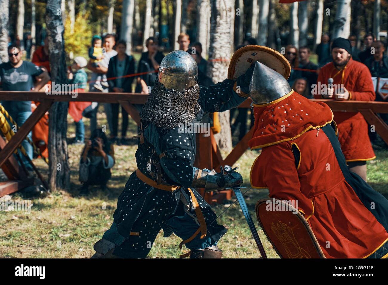 Battle of knights in the arena. Swords, shields, helmets and armor on ...