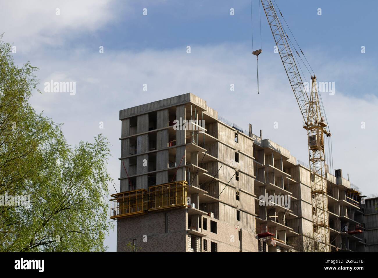 Building a house with a construction crane. Construction of an ...