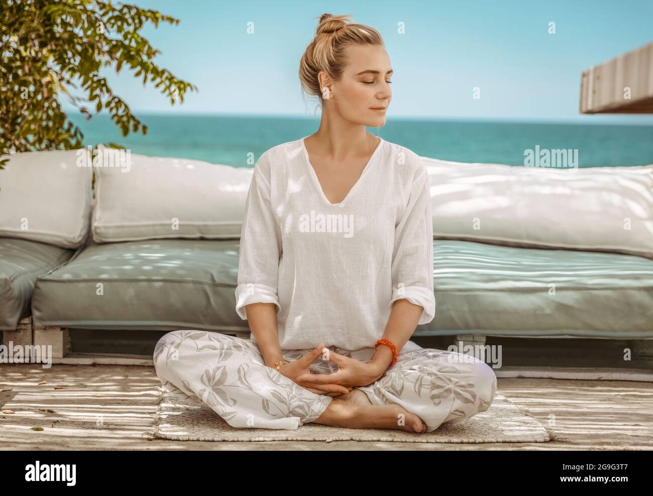 Nice Calm Female with Closed Eyes Sitting in Lotus Pose on the Terrace ...