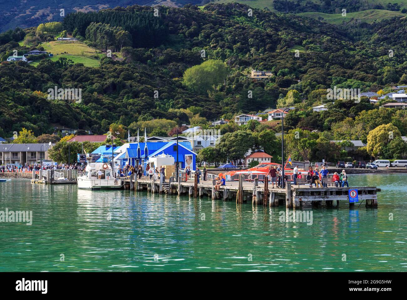 Akaroa, New Zealand. The historic main wharf, where cruise ship ...