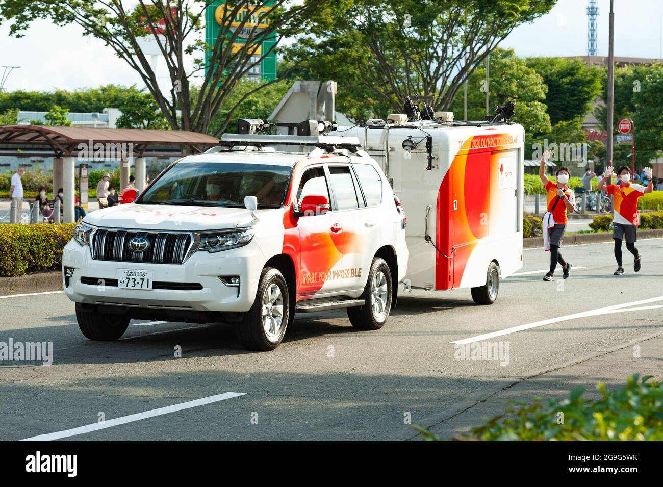 Tokyo 2020 Olympic Torch Relay. Car parade with partners and sponsors ...