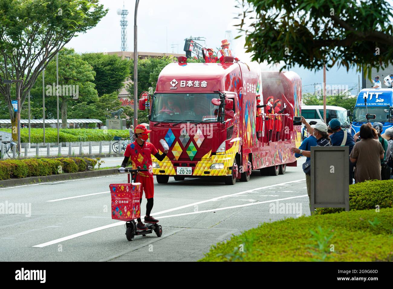 Tokyo 2020 Olympic Torch Relay. Car parade with partners and sponsors ...