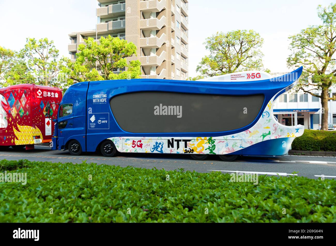 Tokyo 2020 Olympic Torch Relay. Car parade with partners and sponsors ...