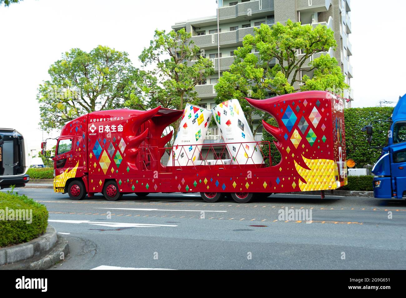 Tokyo 2020 Olympic Torch Relay. Car parade with partners and sponsors ...