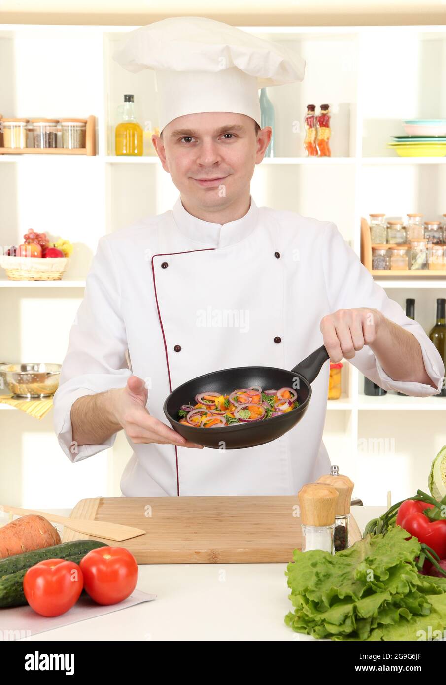 Chef cooking in kitchen Stock Photo - Alamy