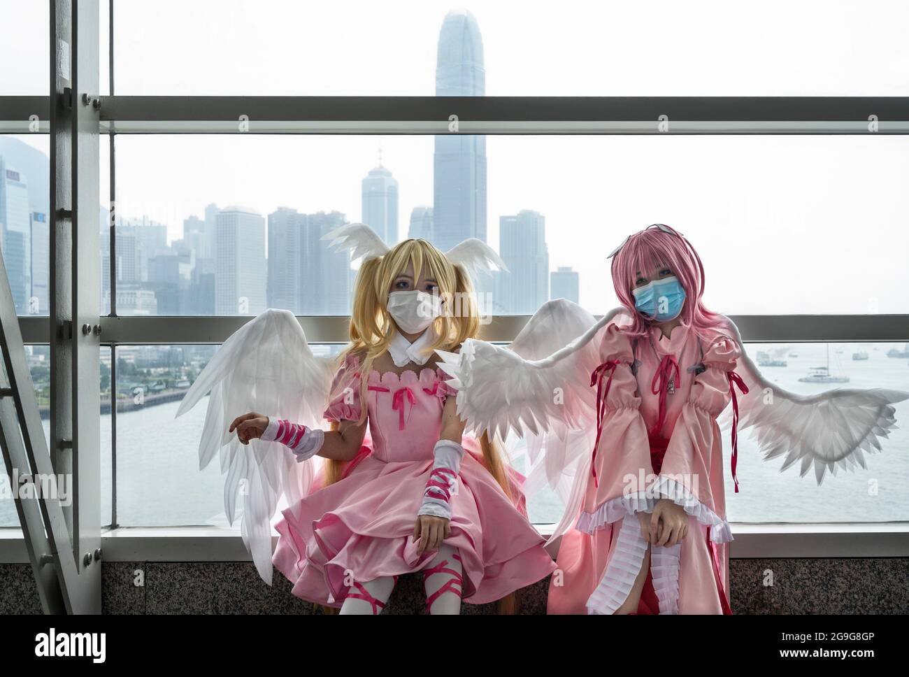 Participant dressed-up cosplayers pose during the Ani-com & Games ACGHK ...