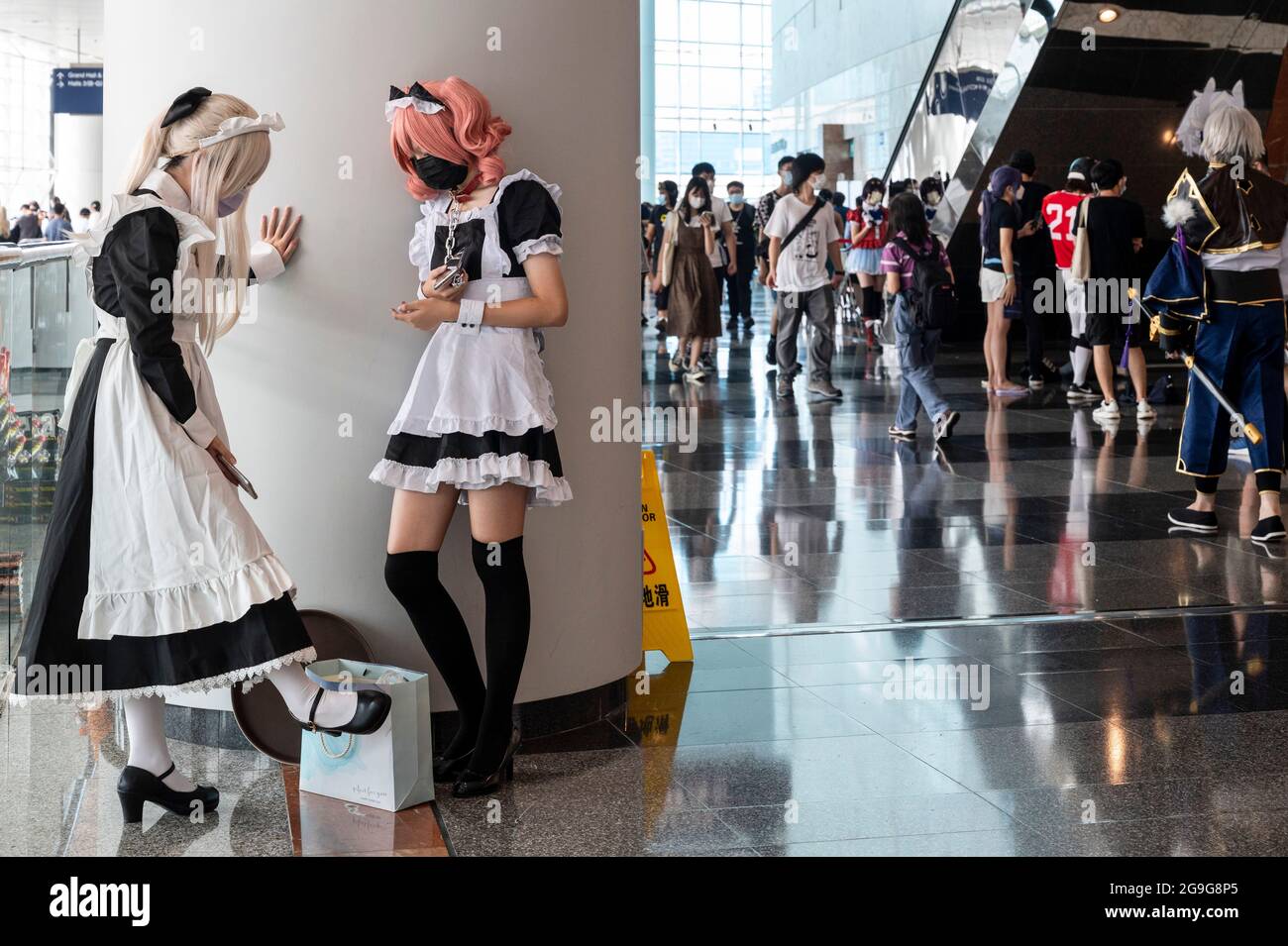 Visitors and participant dressed-up cosplayers are seen during the Ani ...